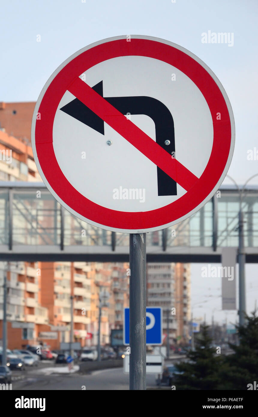 Turn left is prohibited. Traffic sign with crossed out arrow to the left Stock Photo - Alamy