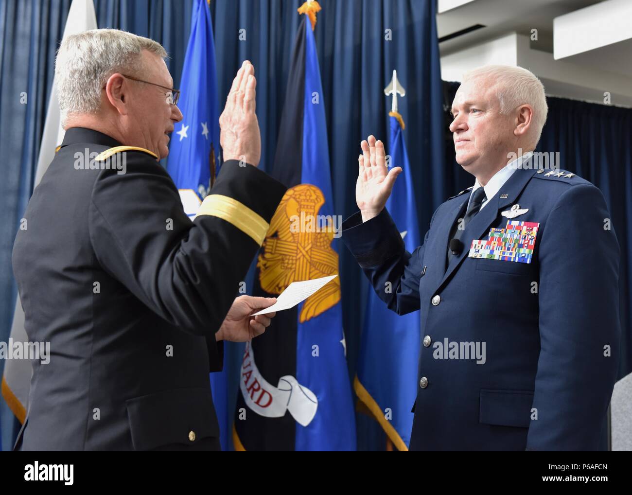 Air Force Lt. Gen. L. Scott Rice reaffirms his oath of office during a ...