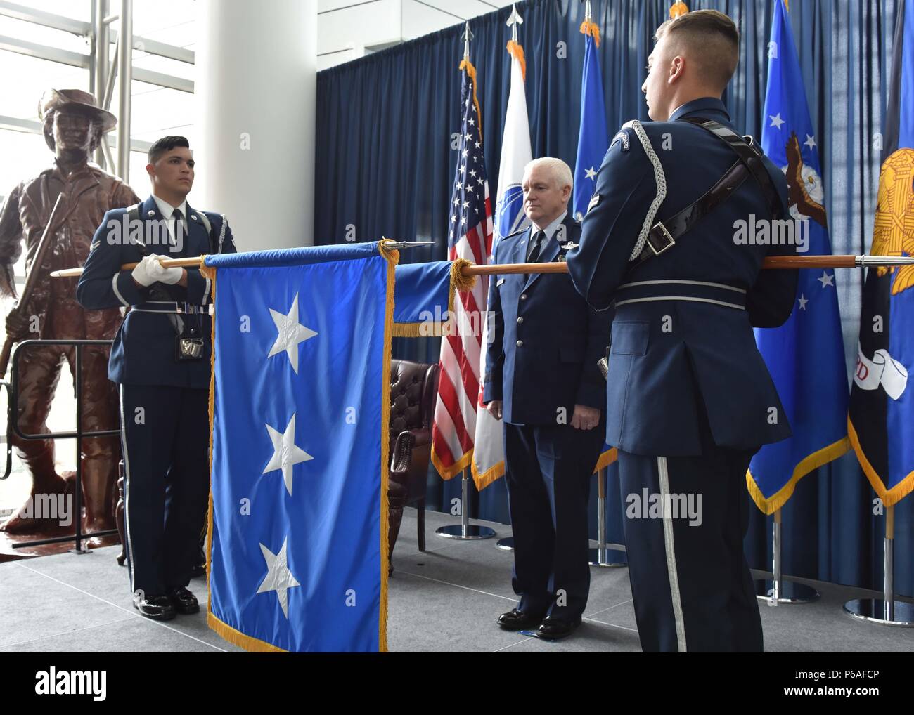 Air Force Lt. Gen. L. Scott Rice is presented with his personal colors ...