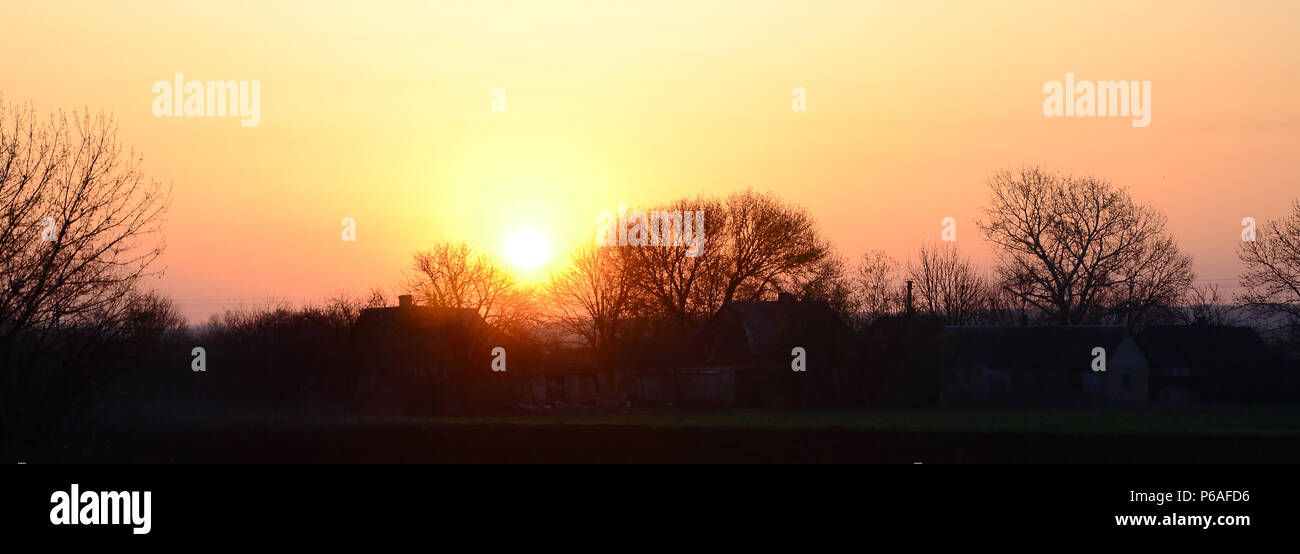 Dawn in the village. Sunrise in the suburban landscape Stock Photo - Alamy