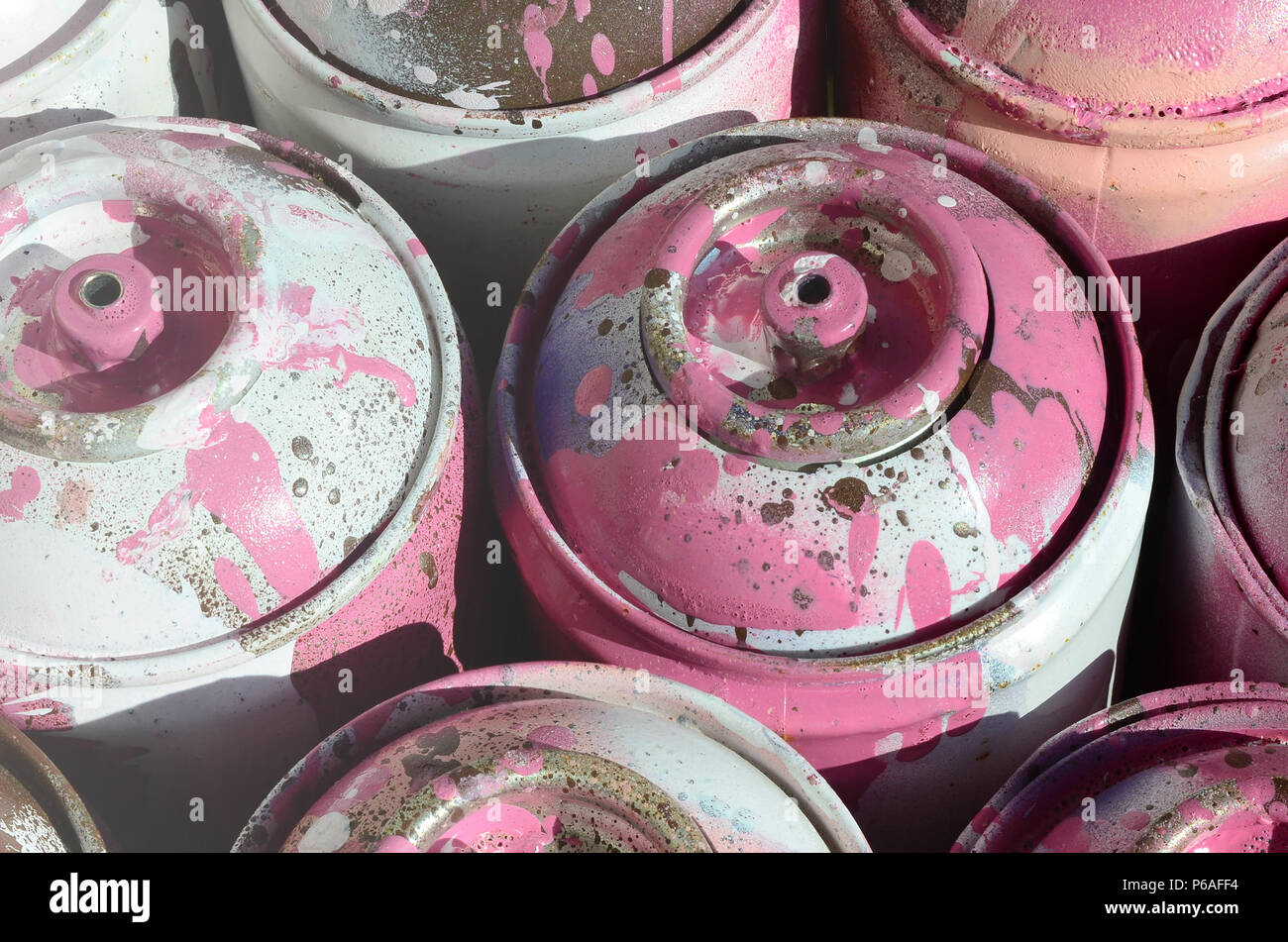 A lot of used pink metal tanks with paint for drawing graffiti Stock ...