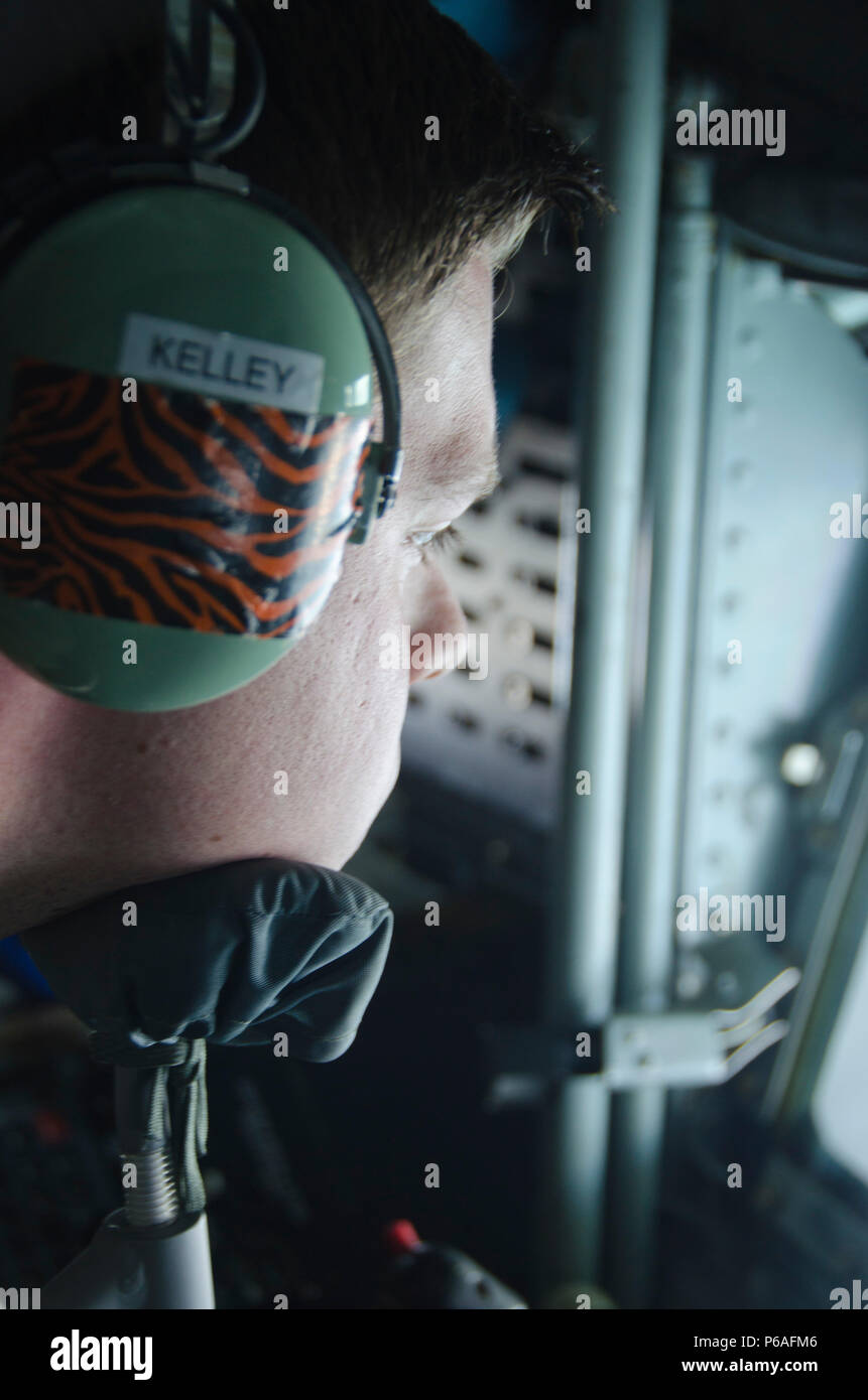 Senior Airman Brian Kelley, Boom Operator, 141st Air Refueling Squadron, looks through the ...