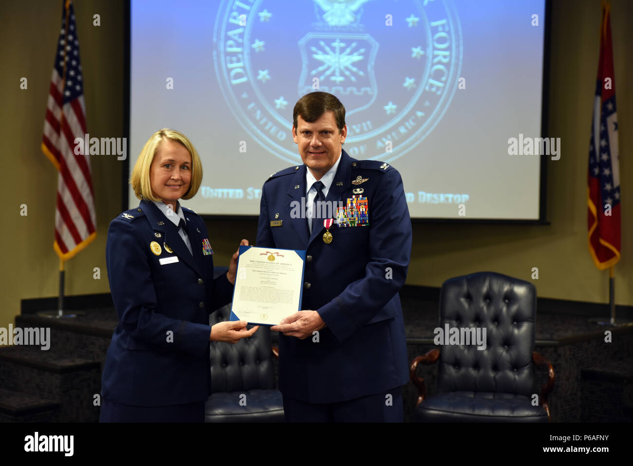 Col. Brian T. Burger, commander of the 188th Operations Group, receives ...
