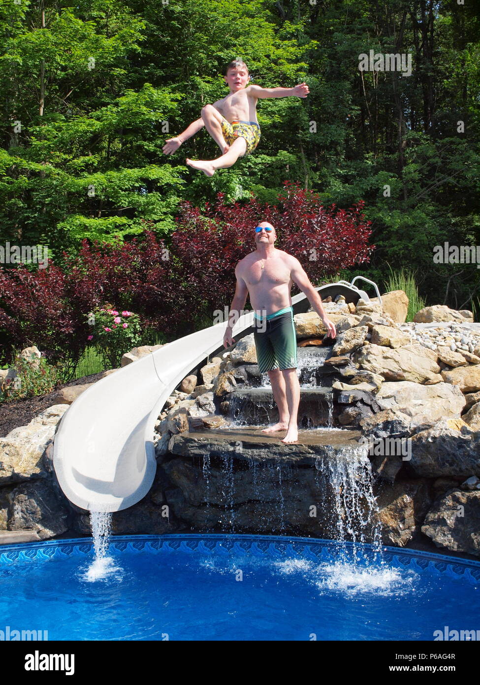 Swimming pool antics Stock Photo - Alamy