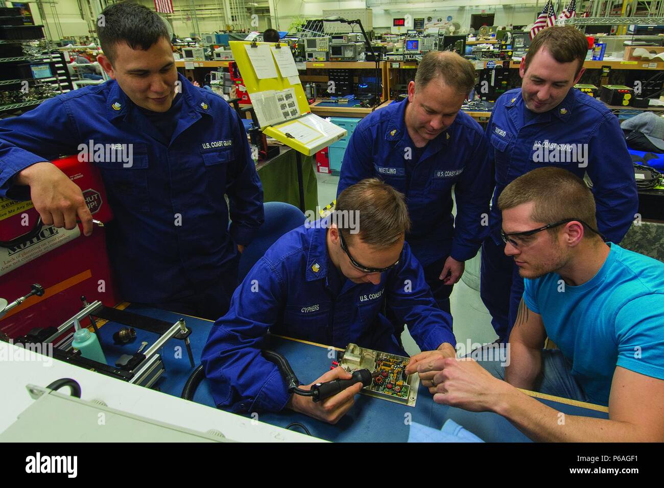 From left, Petty Officer 2nd Class Brian Aebi, Petty Officer 1st Class ...