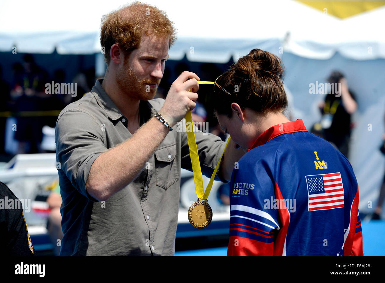 Prince Harry presents the gold medal to U.S. Army Staff Sgt. Elizabeth ...
