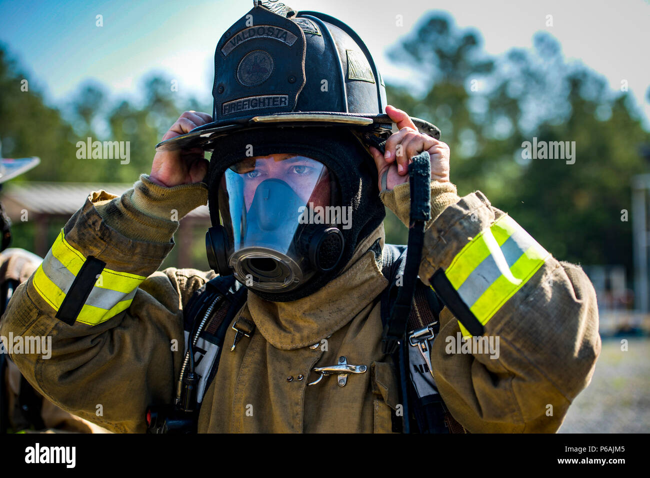 Shelley Miller, Valdosta Fire Department sergeant, gears up during ...