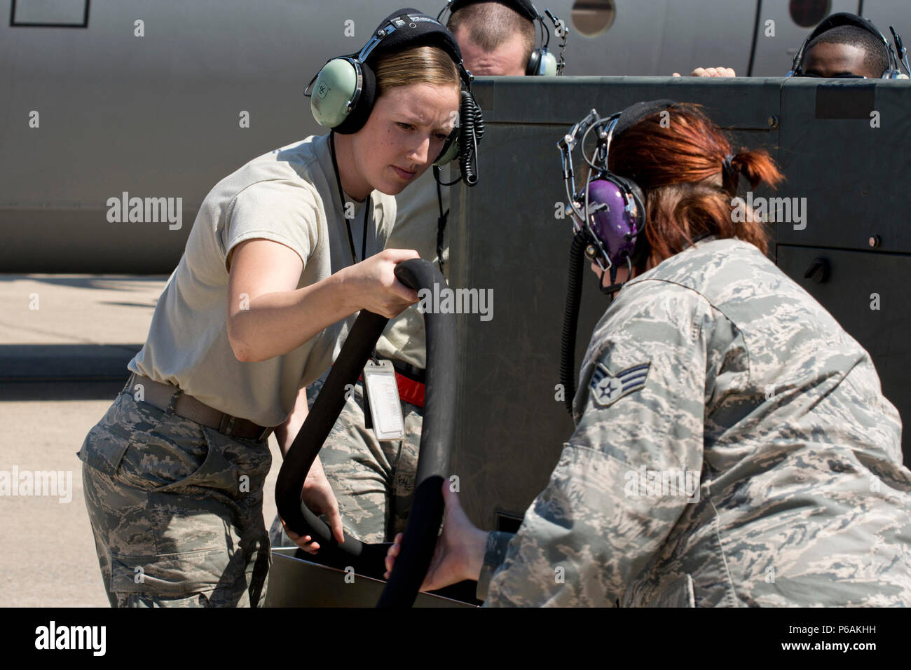(Left) U.S. Air Force Reserve Senior Airmen Jennifer Franke helps stow ...