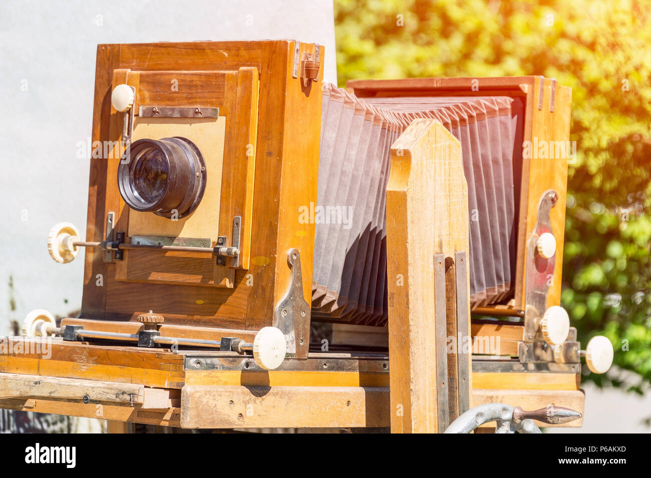 Antique camera on natural background Stock Photo - Alamy