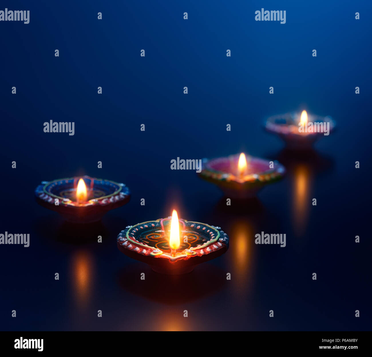 Colorful diya lamps lit during diwali celebration Stock Photo - Alamy