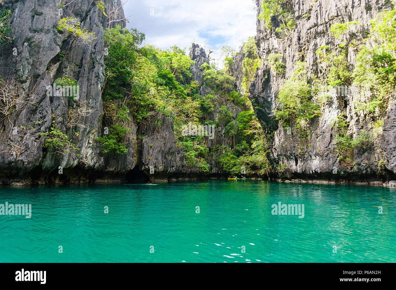 beautiful lagoon with crystal clear turquoise water surrounded by high ...