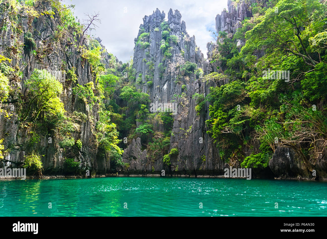 beautiful lagoon with crystal clear turquoise water surrounded by high ...
