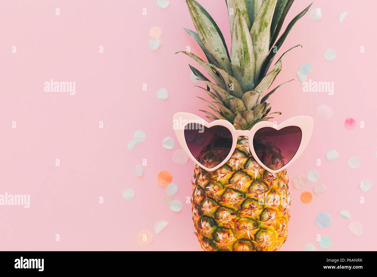 summer vacation and party concept. flat lay. stylish pineapple in pink ...