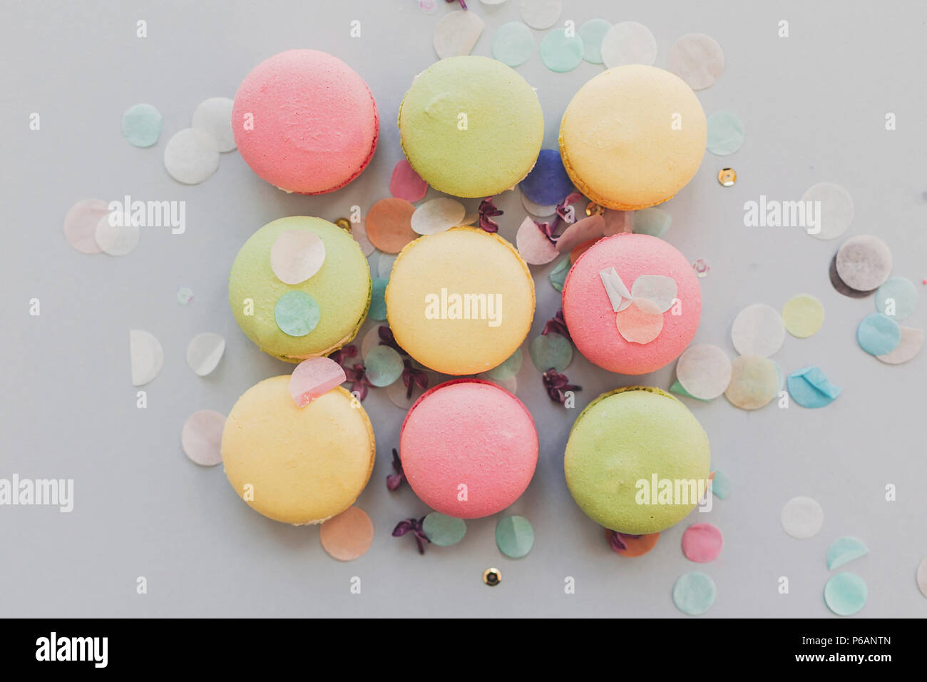 delicious colorful macaroons on trendy pastel gray paper with lilac ...