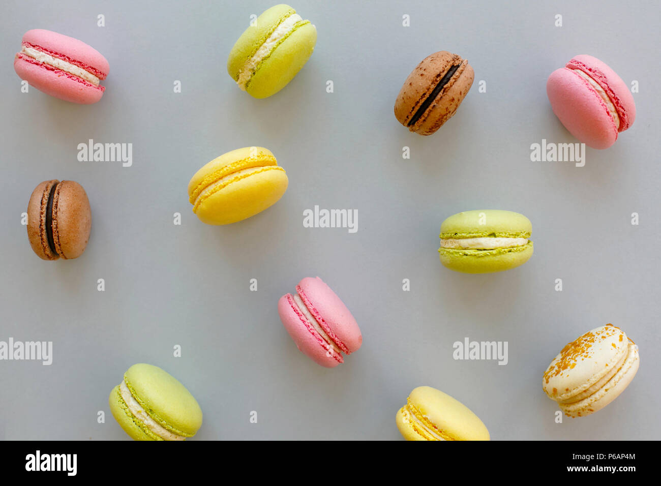 colorful macarons on trendy pastel gray paper, flat lay. tasty pink ...