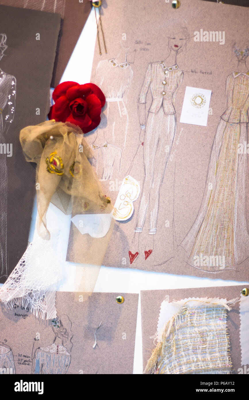 Bridal store hand made dress shop window with drawings, thread and ...