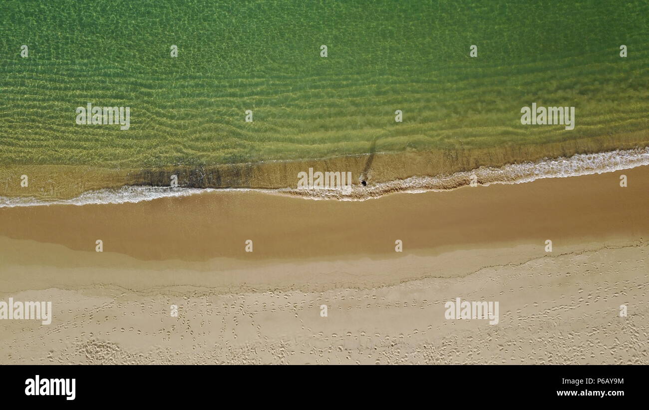 Still waves rippling on the beach Stock Photo - Alamy