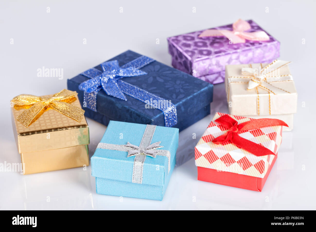 Six small gift boxes isolated on white background Stock Photo - Alamy
