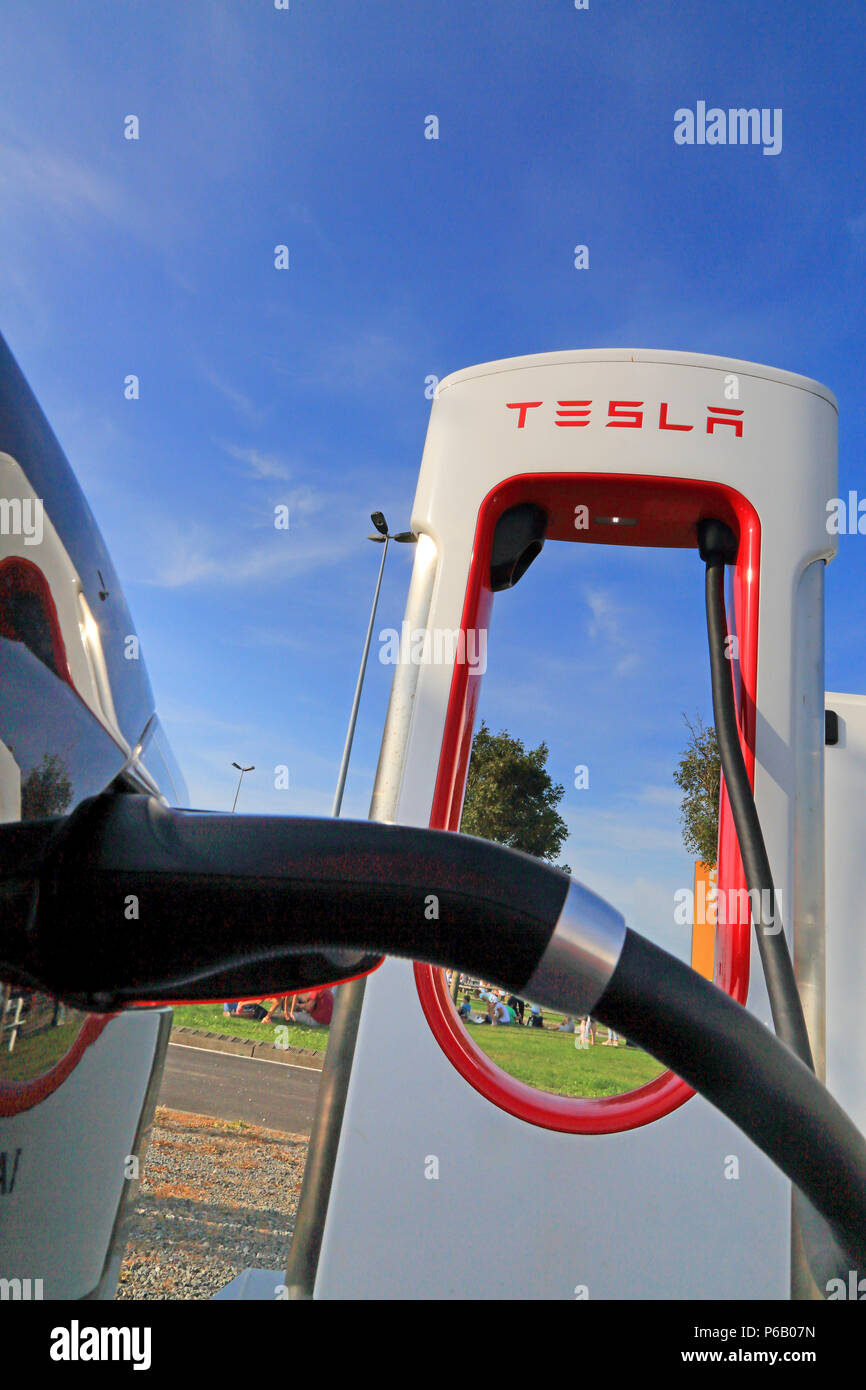 Tesla car charging Stock Photo - Alamy