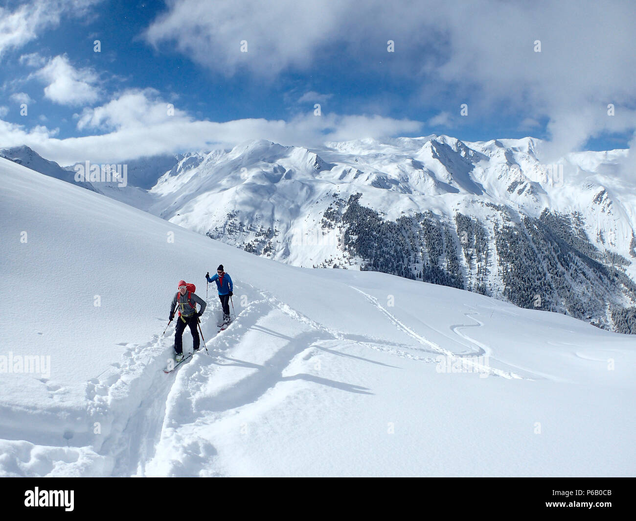 Austria, Tirol, Sellrain valley, 2 men on nordic skiing are moving in ...