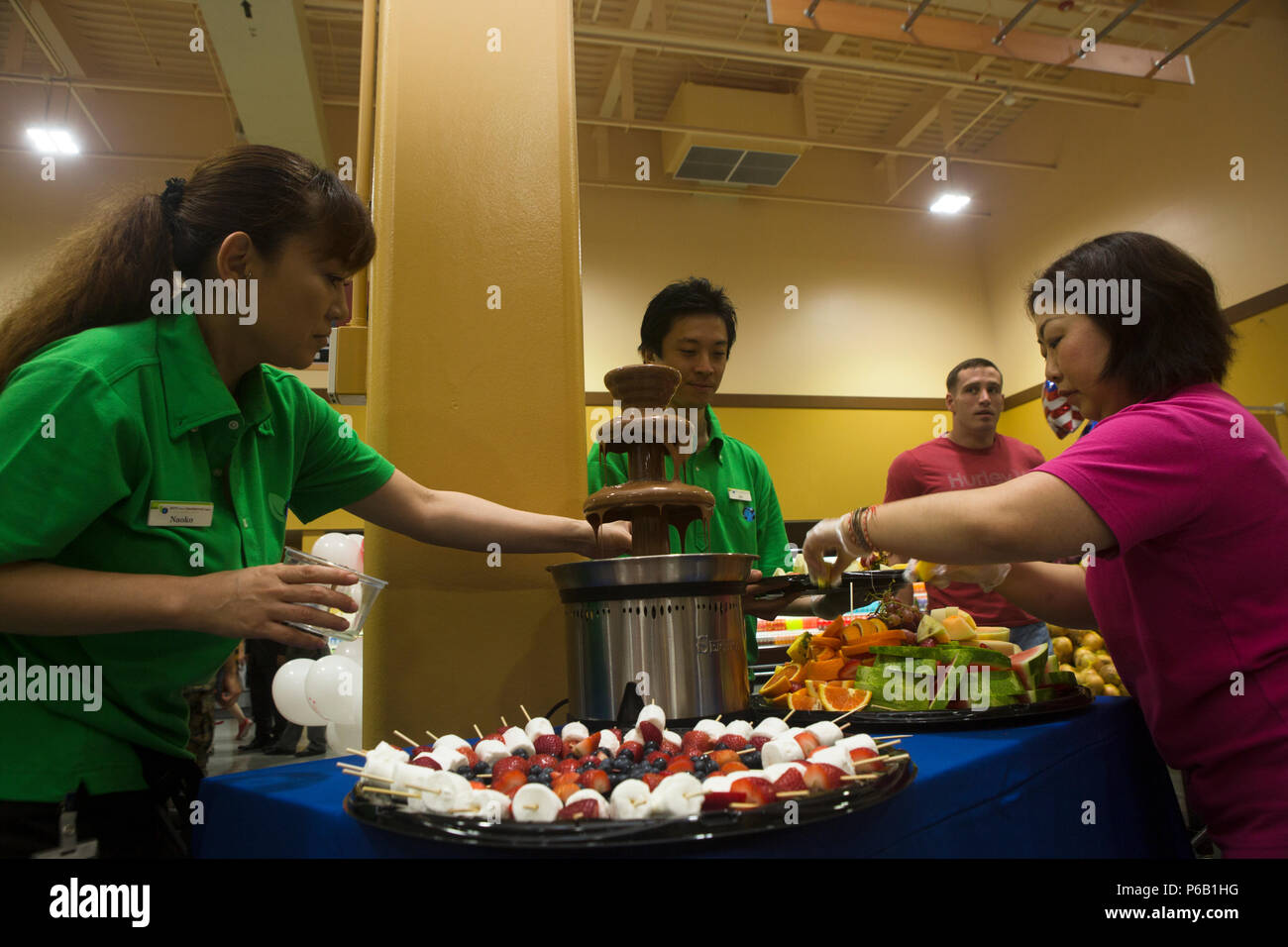U.S. military service members and civilian personnel attend the grand ...