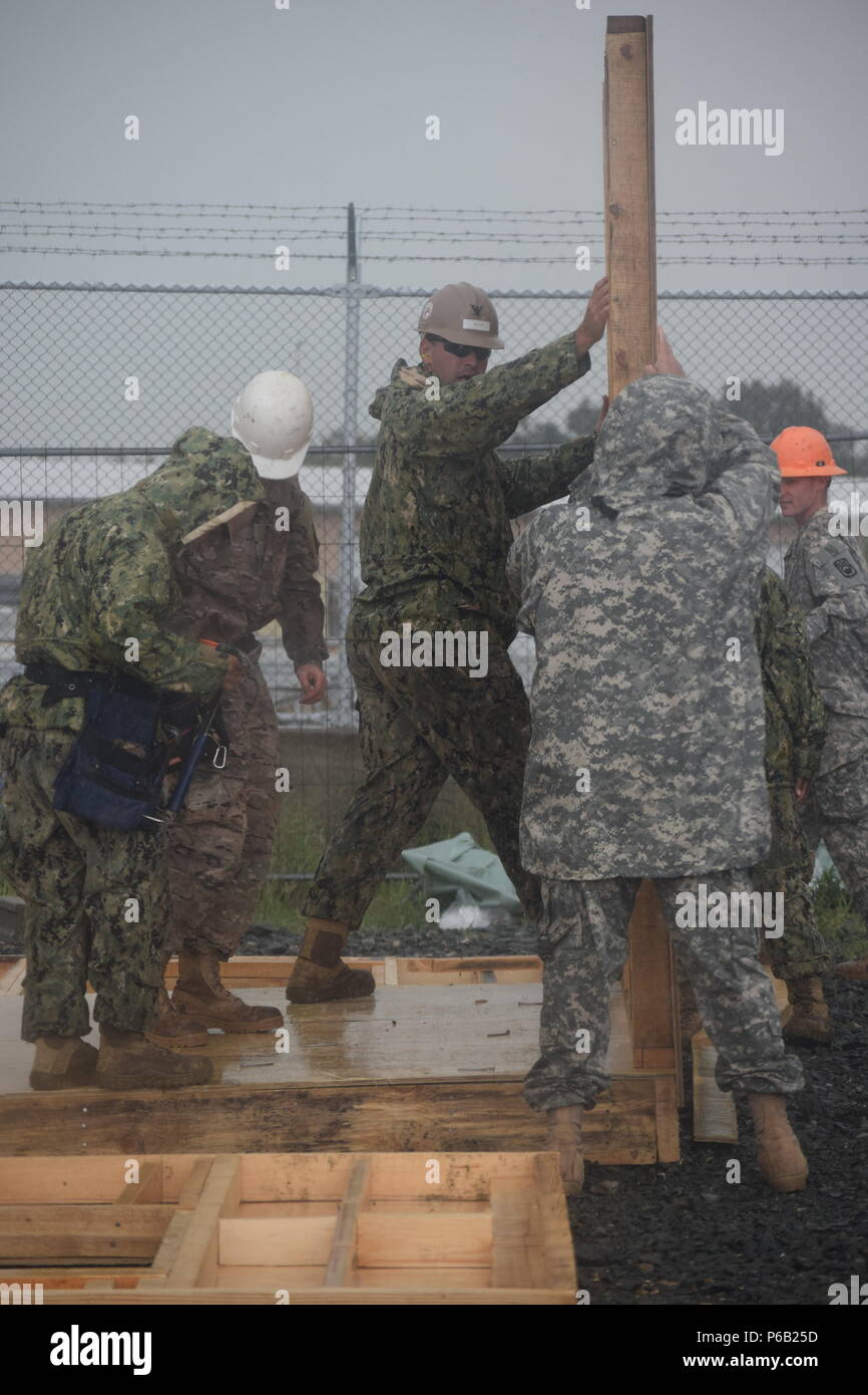 Builder Third Class Michael Taylor and his crew, along with members of ...