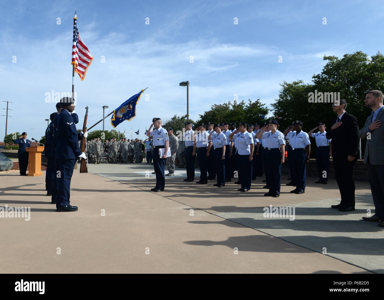 Members of the 9th Security Forces Squadron present the colors during a ...