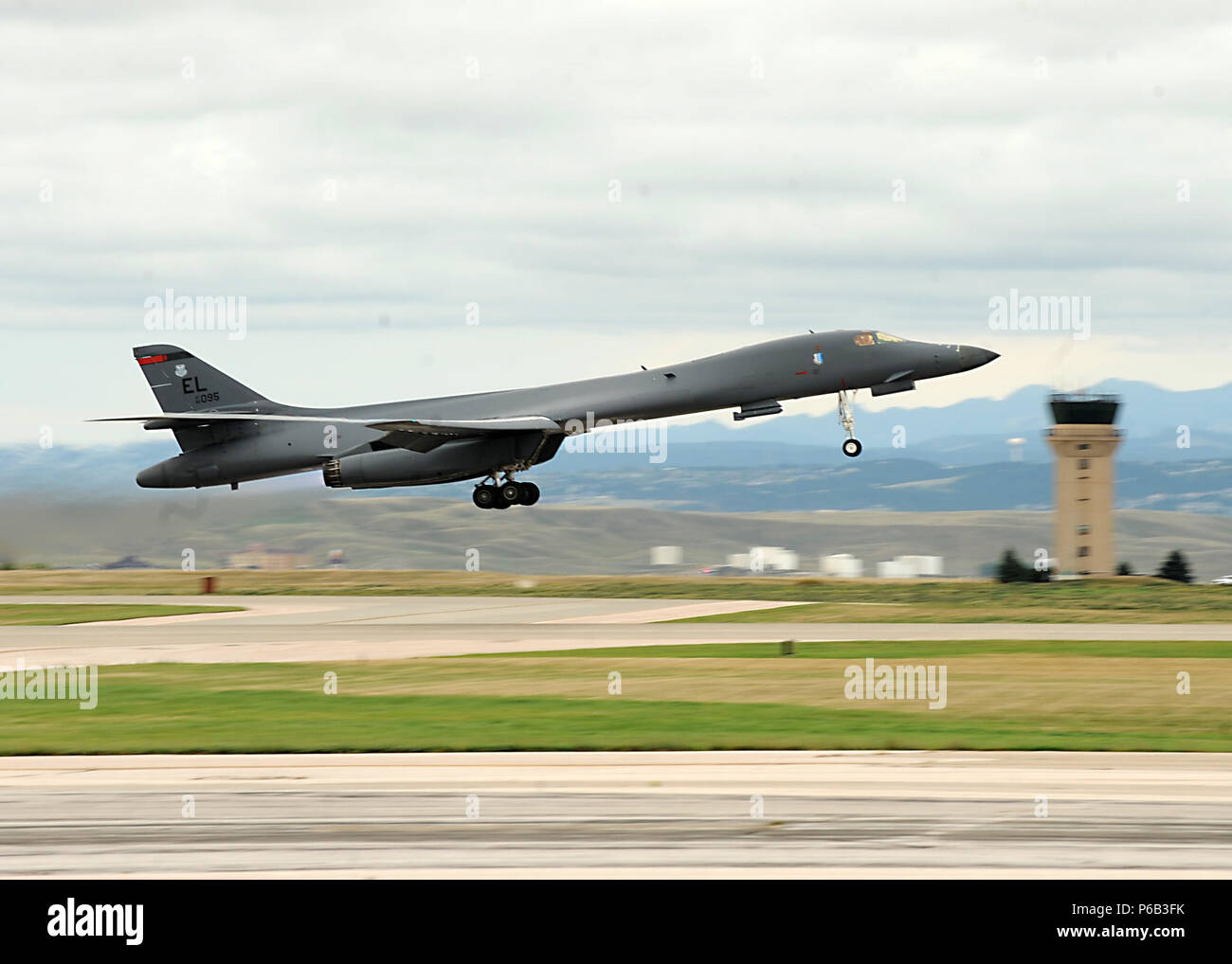 A B-1 bomber takes off from the runway while using full afterburners at ...