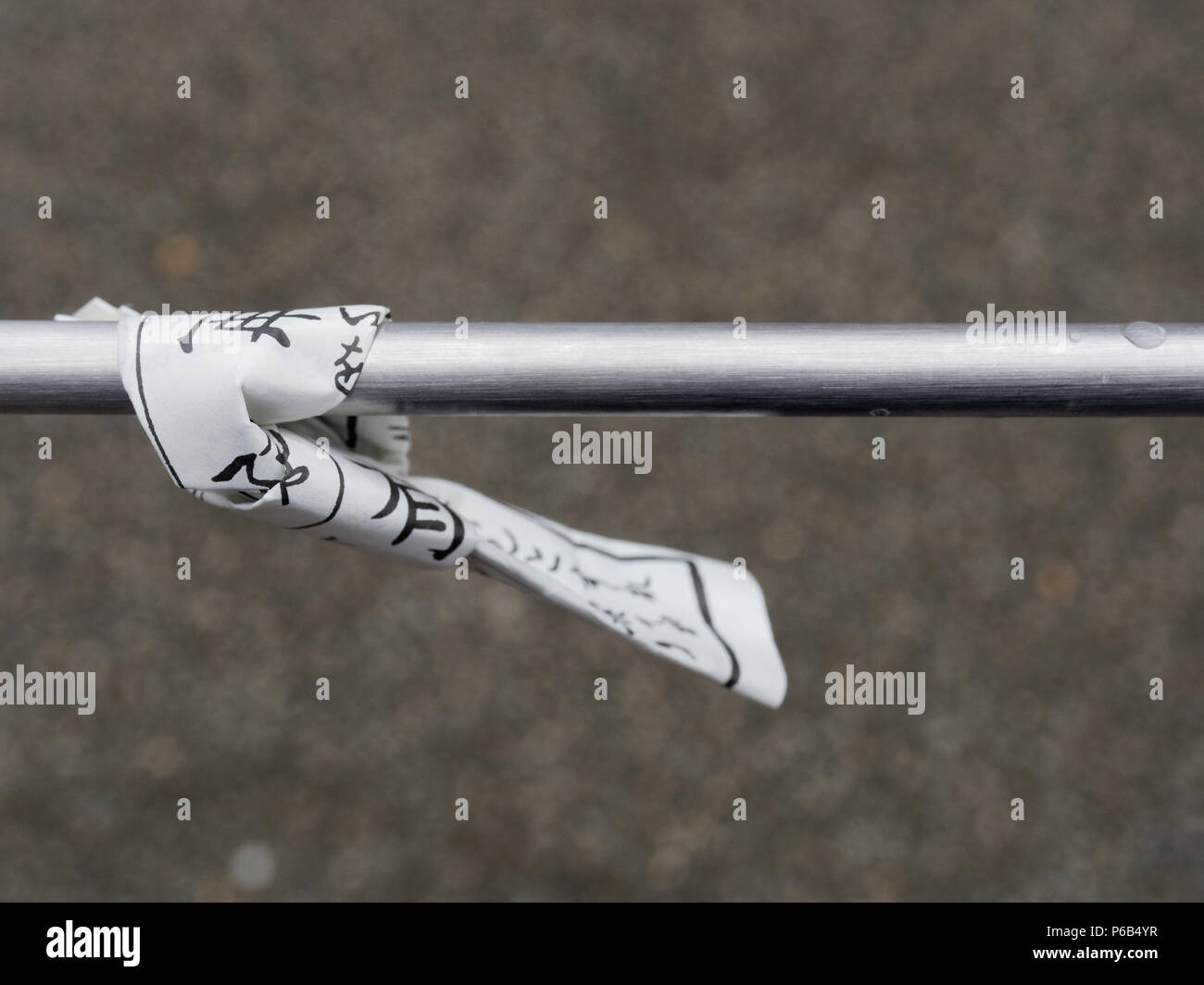 TOKYO, JAPAN - SEPTEMBER 28, 2017 : Fortune paper was tied and leaved ...