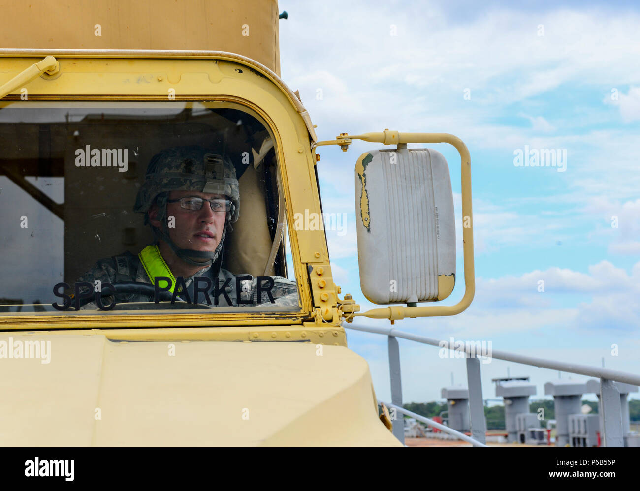A 226th Composite Supply Company mechanic, drives a Humvee on the M/V ...