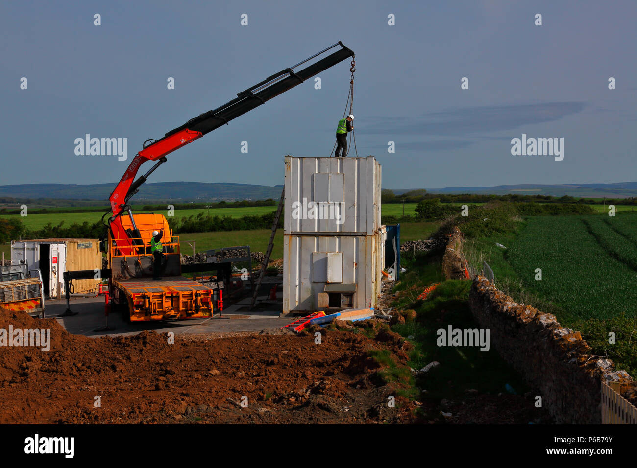 Removal day and the container office is chained up and hoisted aboard ...