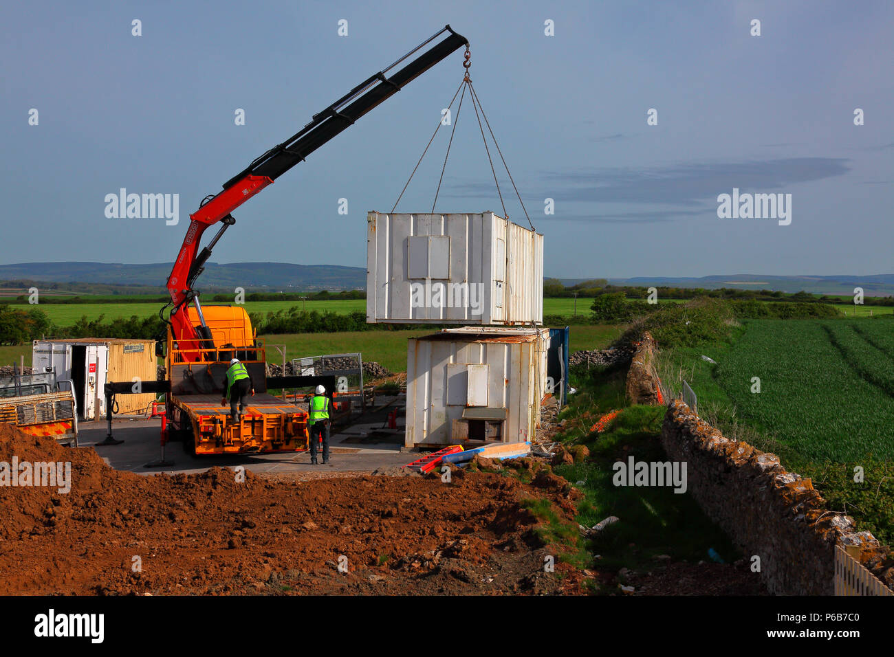 Removal day and the container office is chained up and hoisted aboard ...
