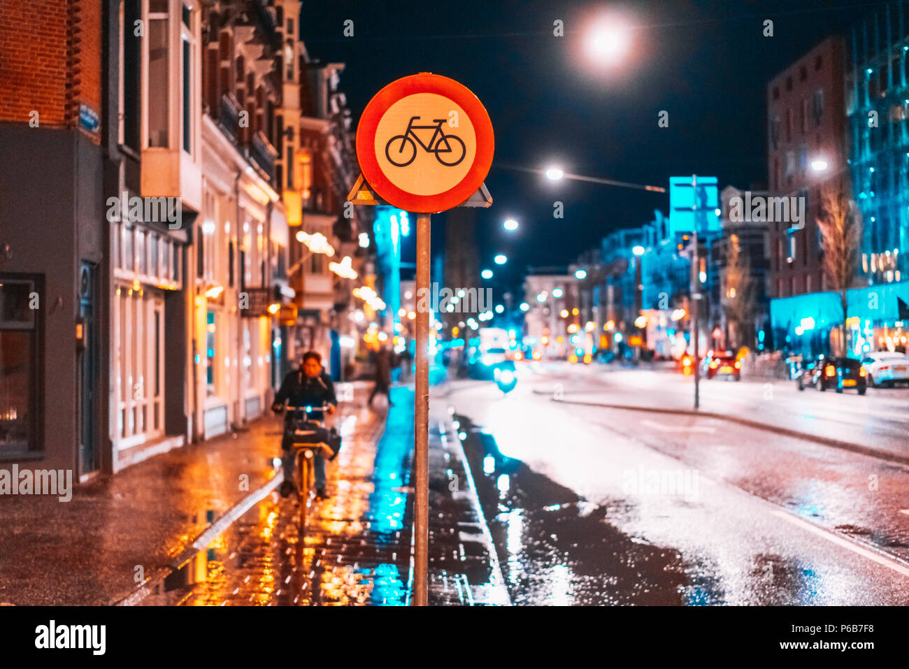 Bicycle lane sign on a night street Stock Photo - Alamy