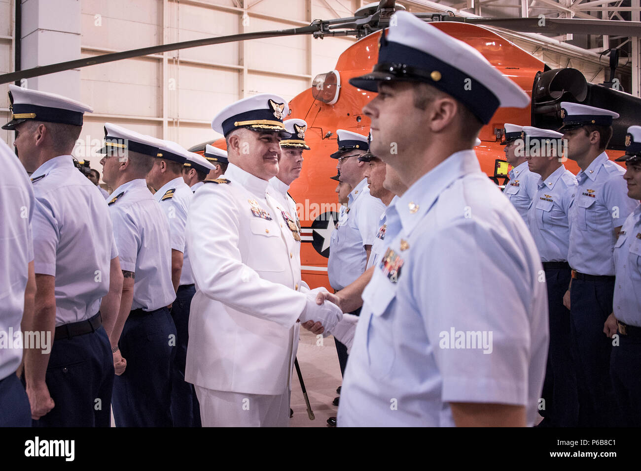 Capt. Marshall Branch and Cmdr. Brian Erickson inspect the crew of ...
