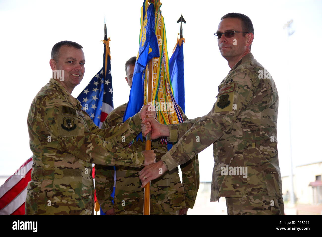 Lt. Col. Bryan Tuinman, right, accepts command of the 40th Helicopter ...
