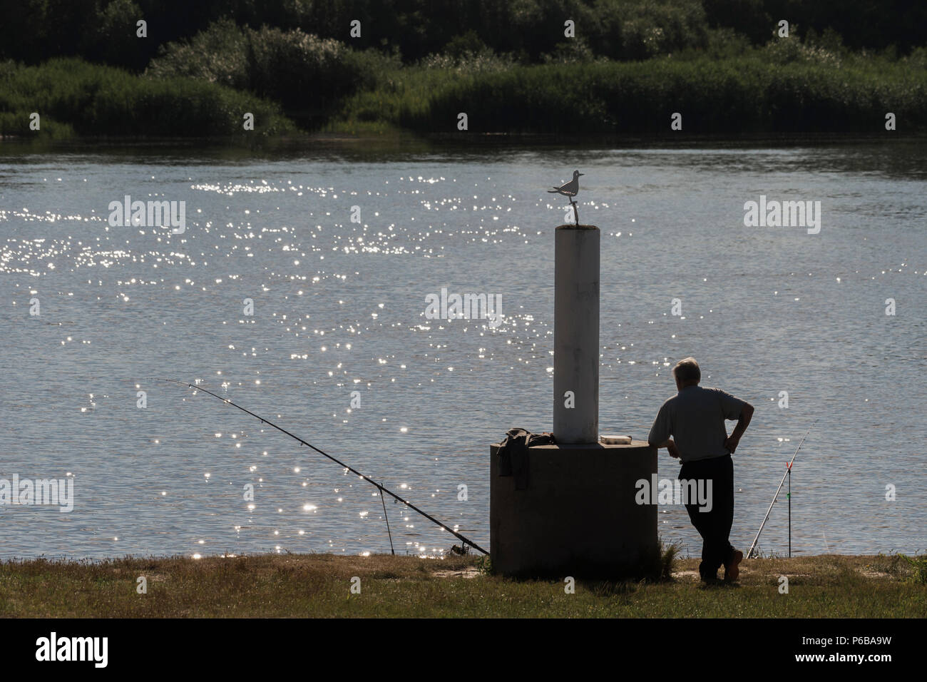 Man sitting in chair fishing hi-res stock photography and images - Alamy