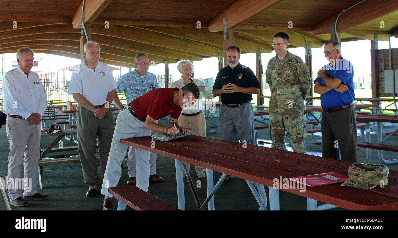 Eddie Somers, president, Smith Island United, signs a piece of jetty ...