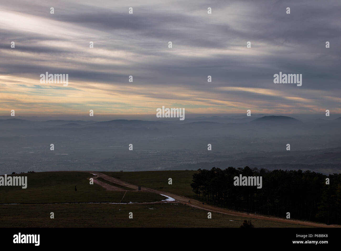 Subasio Mt. (Umbria, Italy), with sky covered by clouds and warm sunset ...