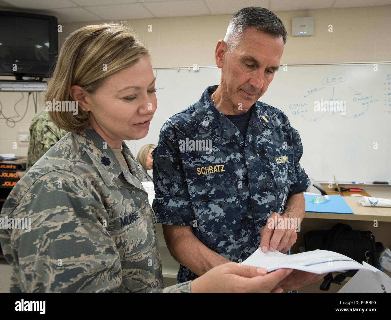 U.S. Air Force Lt. Col. Amy Mundell (left), a medical administrative ...