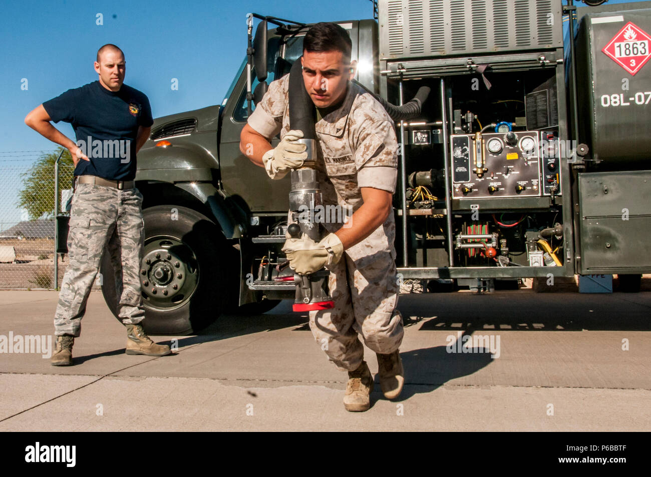 Under the watchful eye of Air Force Staff Sgt. Scott Frank, Marine ...
