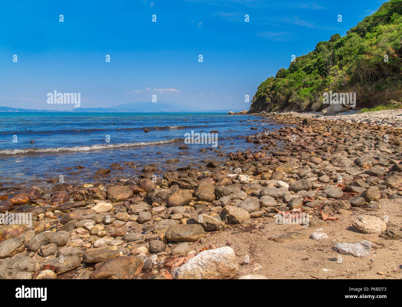 Sea shore stone wave background Stock Photo - Alamy