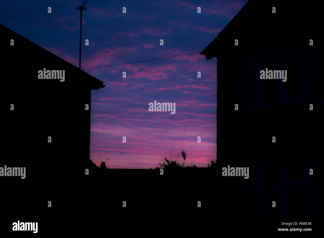 Night time view of house exterior of terraced houses on a street Stock ...