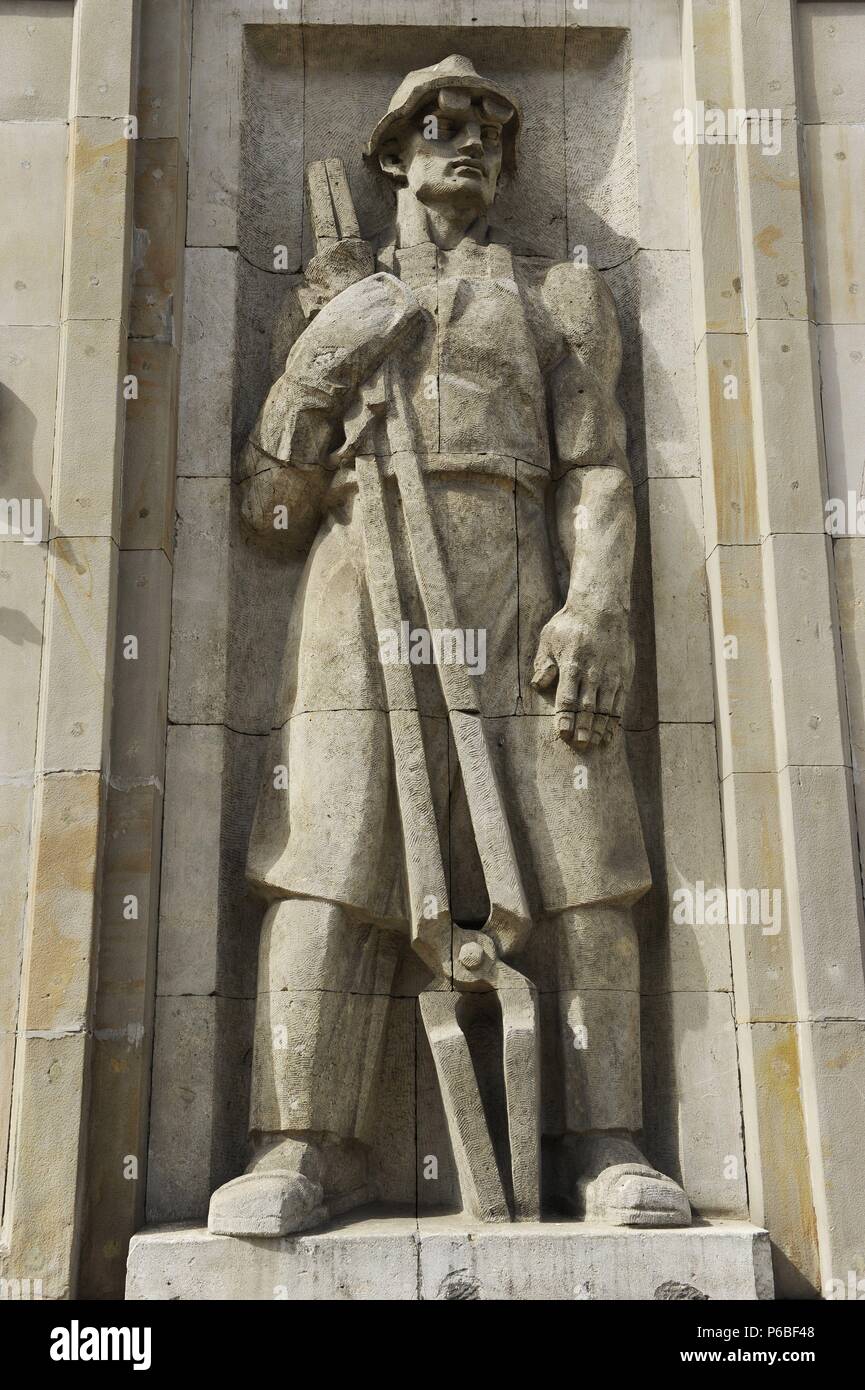 Poland. Warsaw. Socialist relief. Constitution Square Stock Photo - Alamy