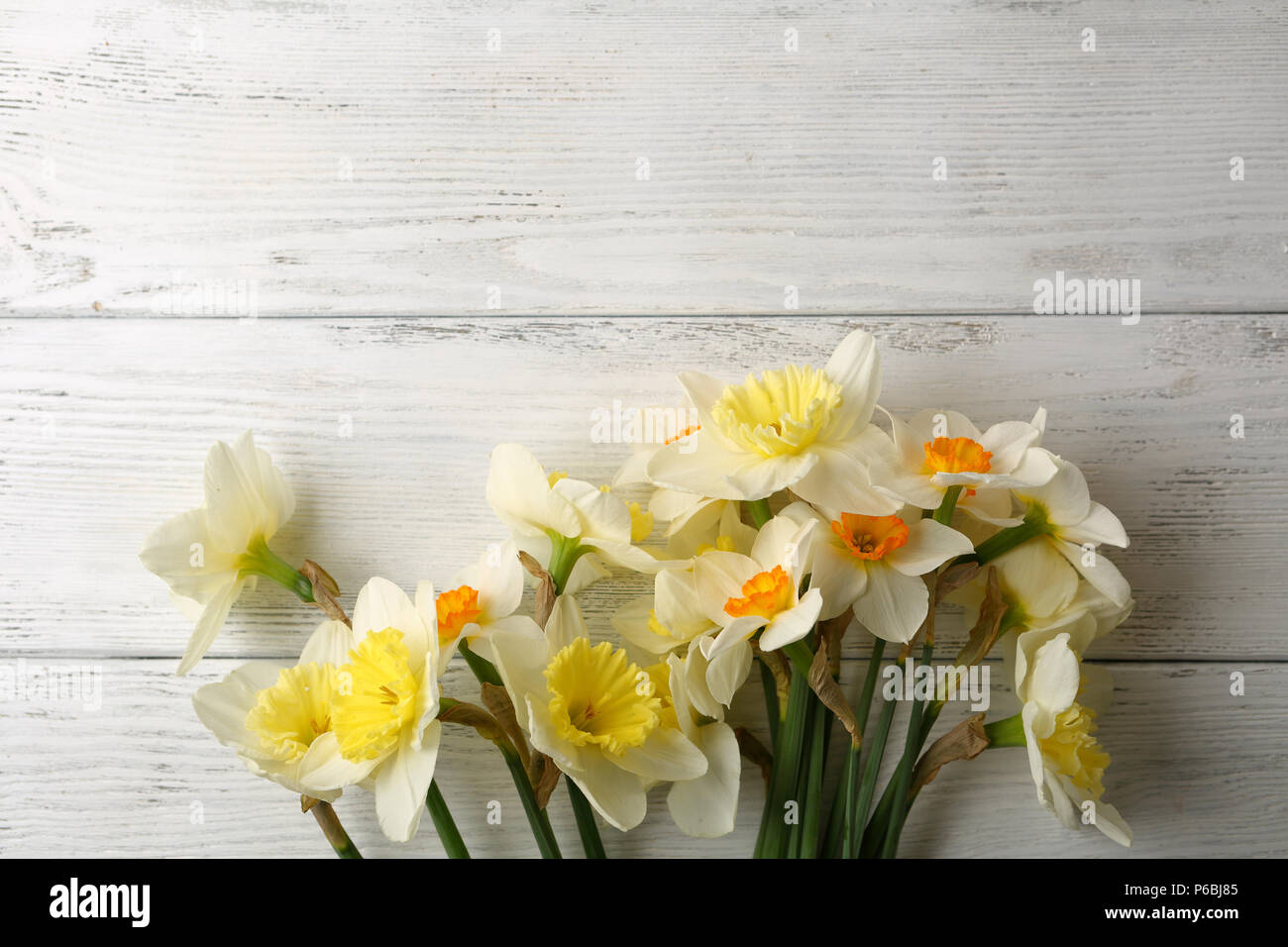 Spring flowers on rustic surface Stock Photo - Alamy