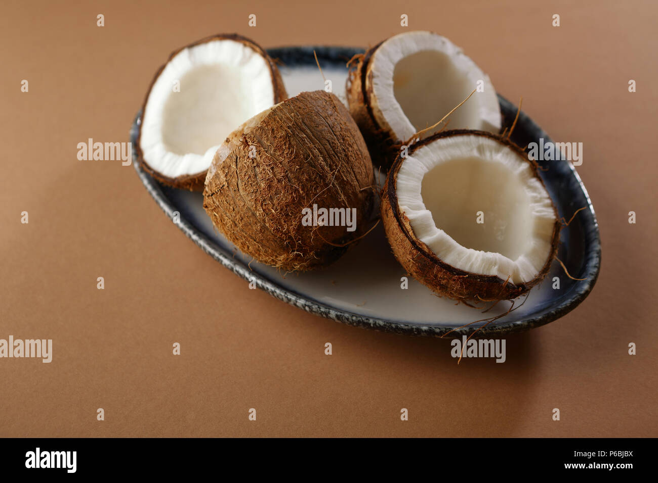 Three pieces of coconuts on plates Stock Photo - Alamy