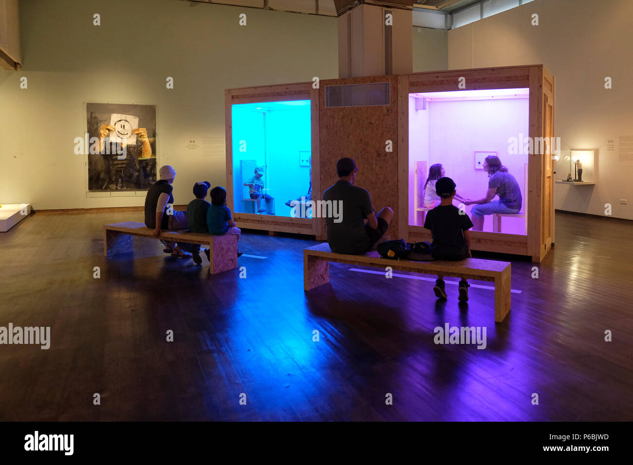 Parents with their children interact with an art installation at the ...