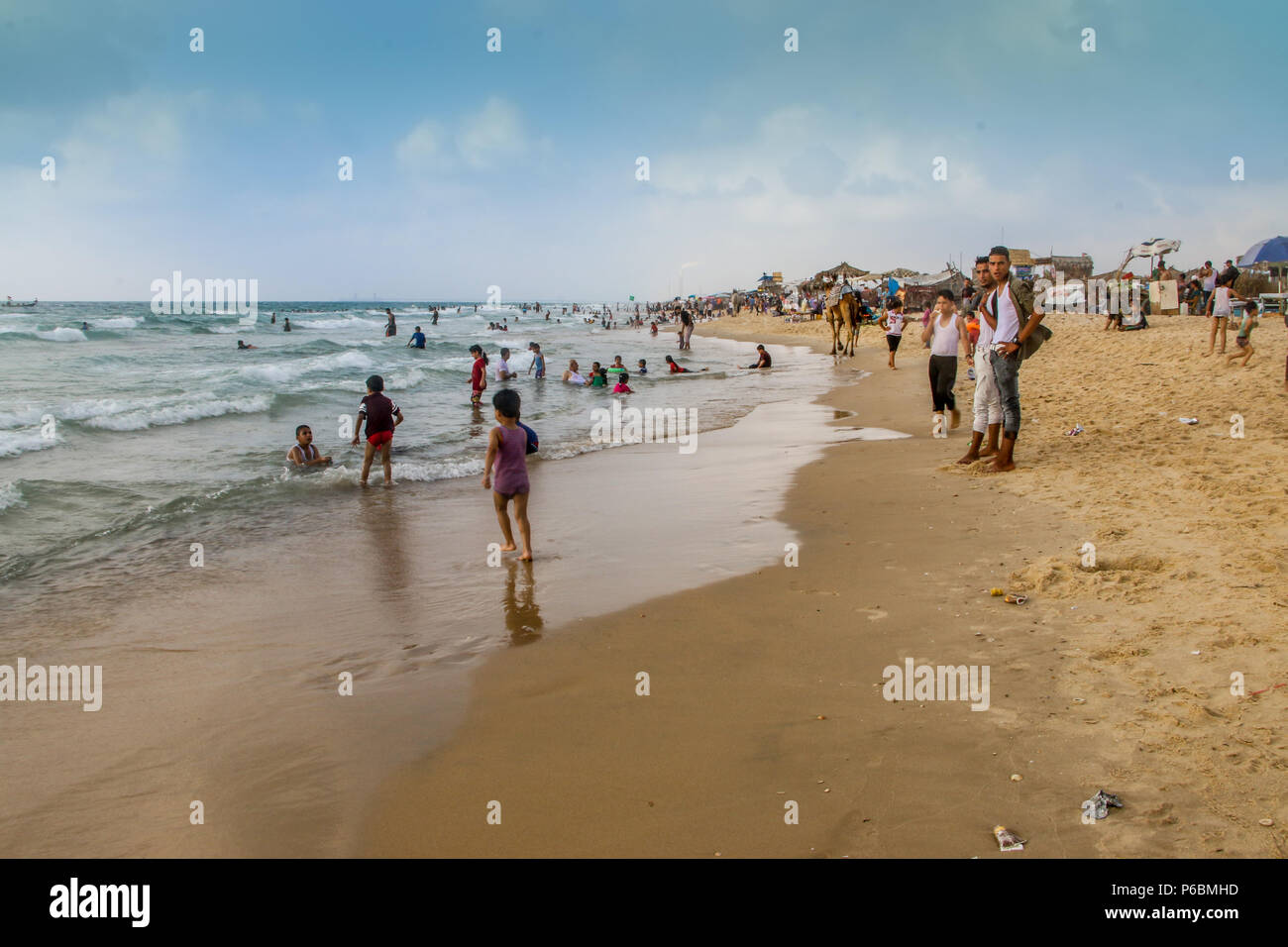 The seashore of the Gaza Sea is crowded with holidaymakers and is the ...