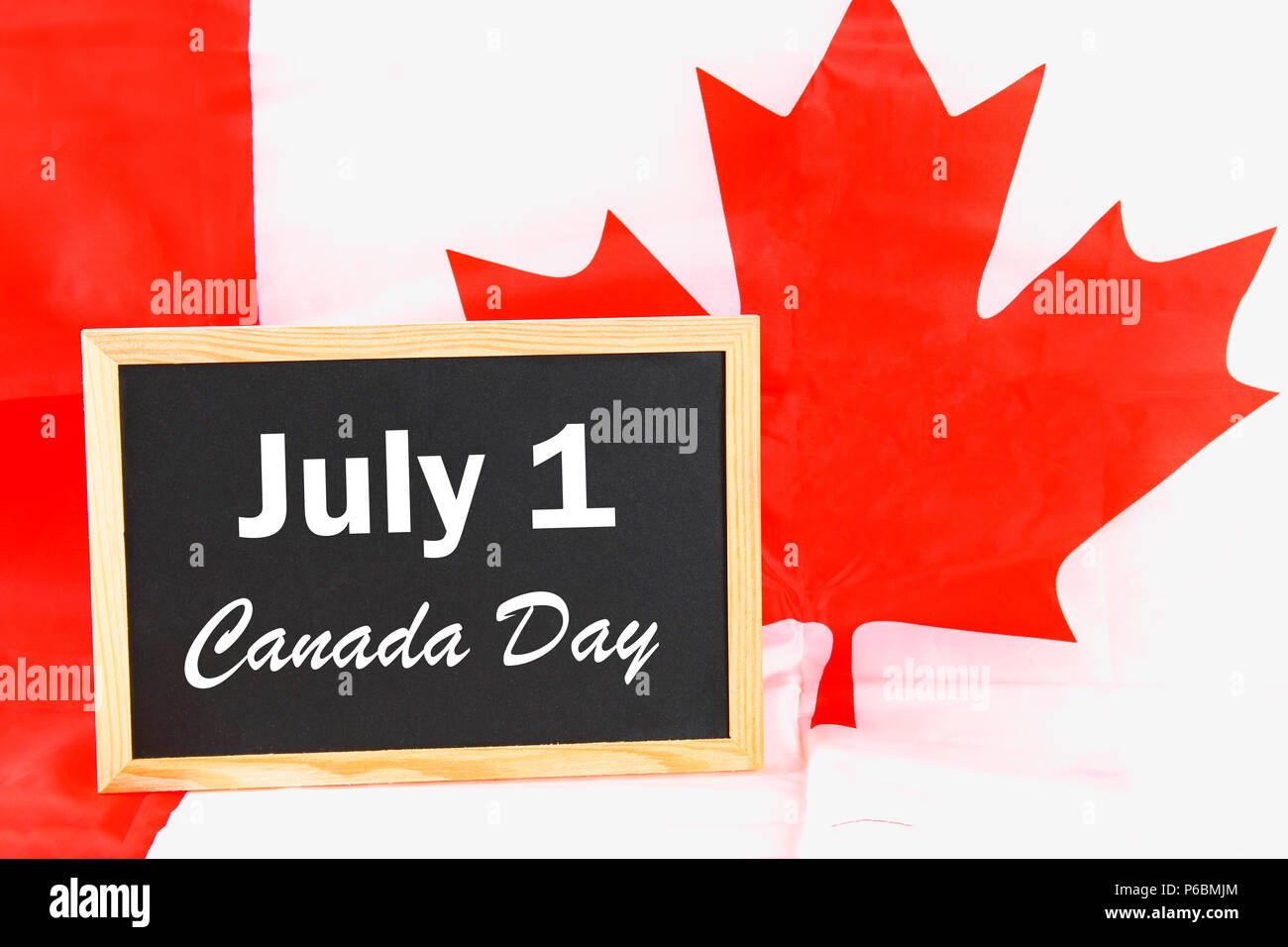 Chalkboard with the word Happy Canada Day on the national flag. Feast ...