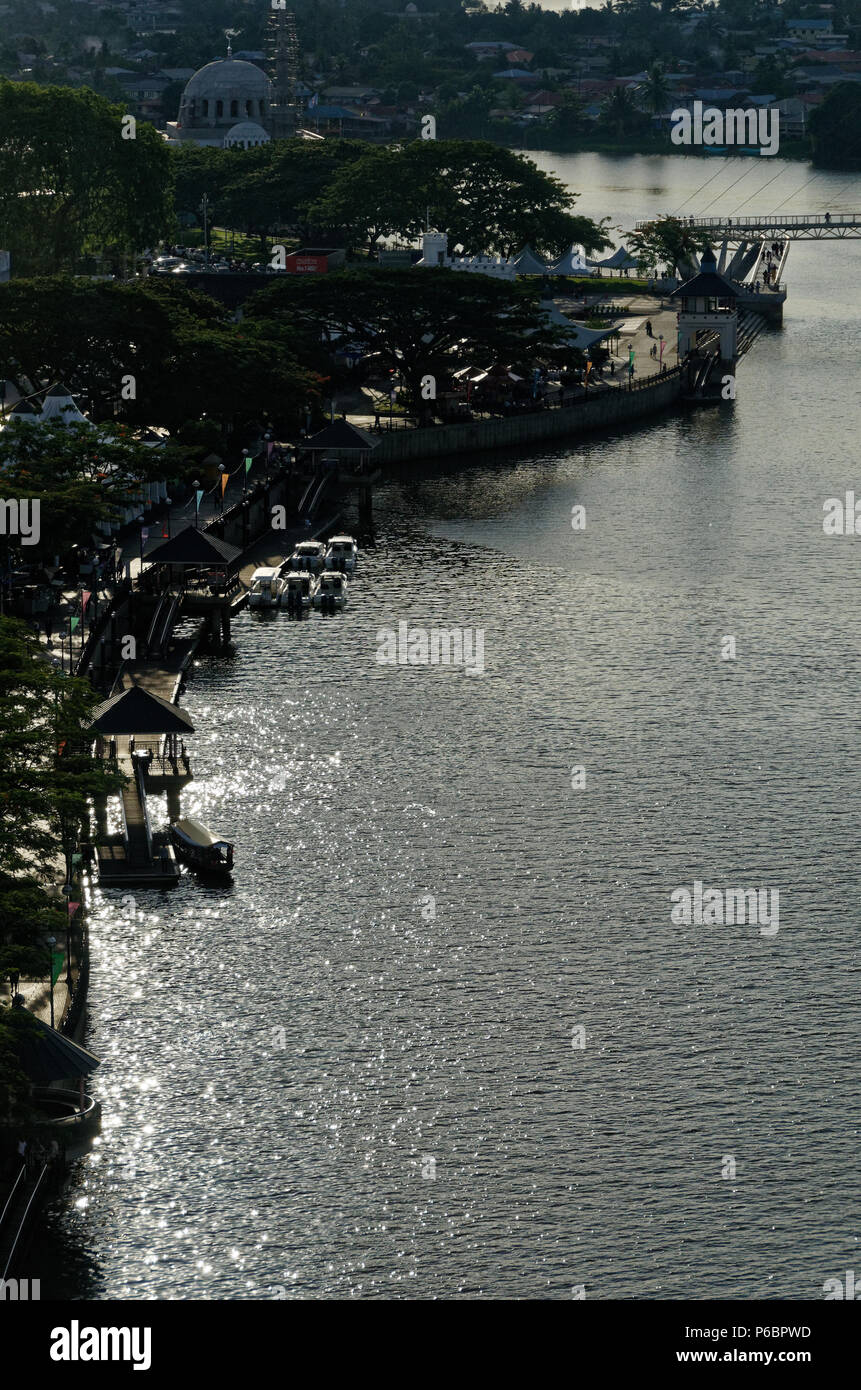 Sunshine reflecting on the Sarawak River makes the Kuching Riverside ...