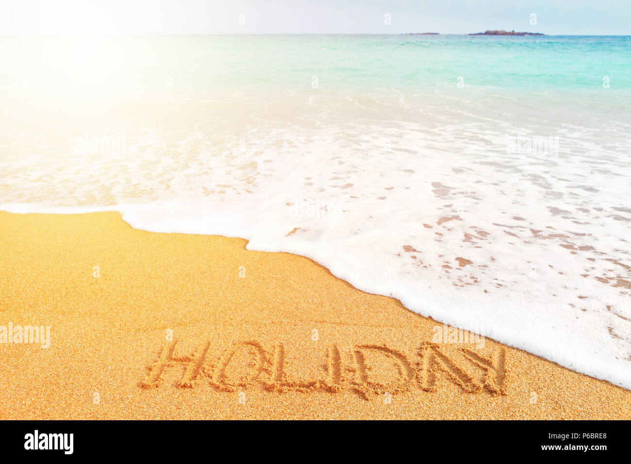 Hawaii written on sand hi-res stock photography and images - Alamy